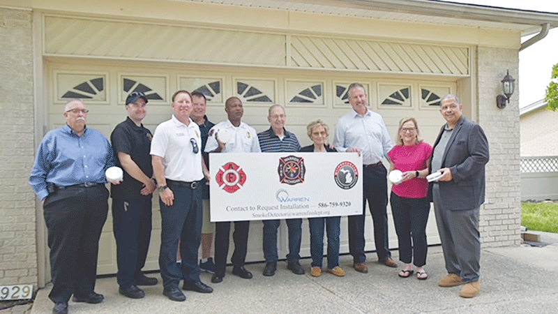 Firefighters install smoke detectors for Warren homeowners