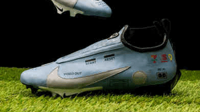 U of M football star auctions off custom cleats for charity