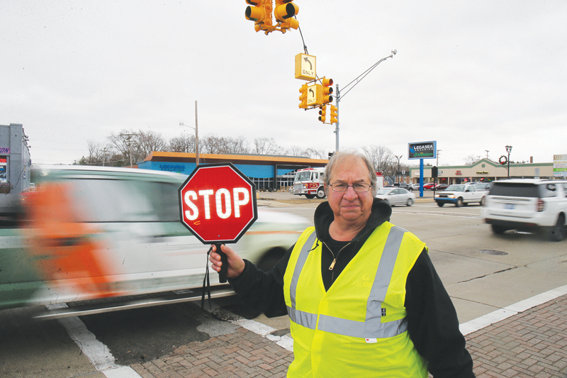 Utica firefighters donate LED stop signs for crossing guards at 2 ...